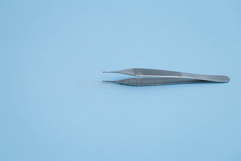 Steel Dental Tweezers on Light Blue Background Stock Photo - Image of ...