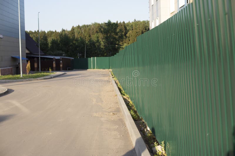 Steel Fence. the Fence is High on the Street Stock Image - Image of ...