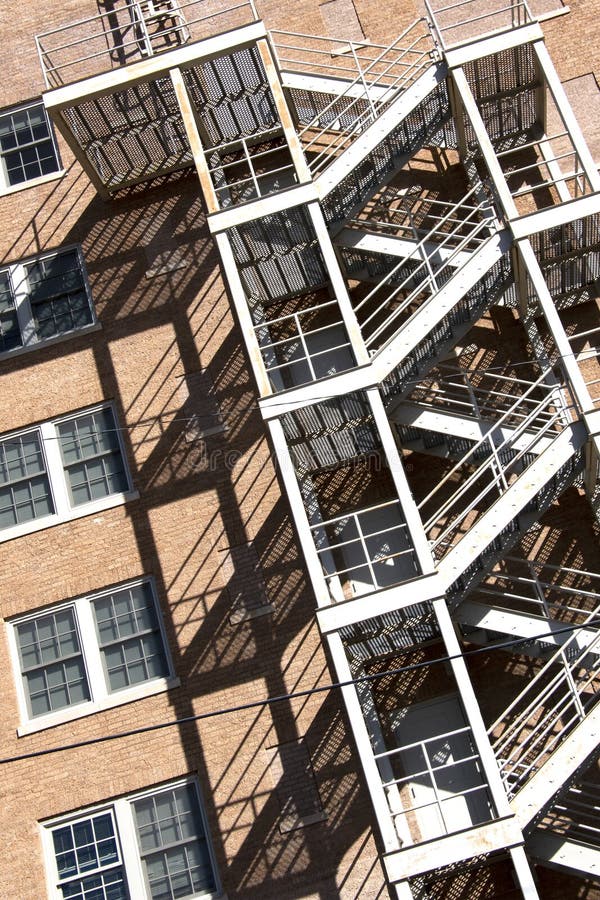An Outdoor Fire Escape on the Back Side of an Apartment Building Stock ...