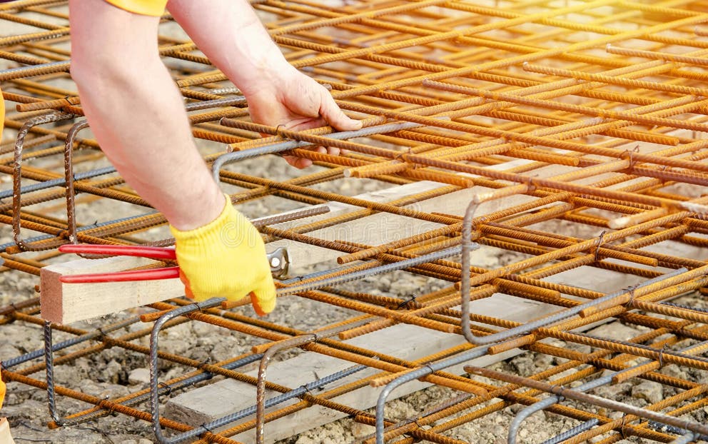 Steel Fixer Assembling Reinforcement Cage Off Rebars. Selective Focus ...