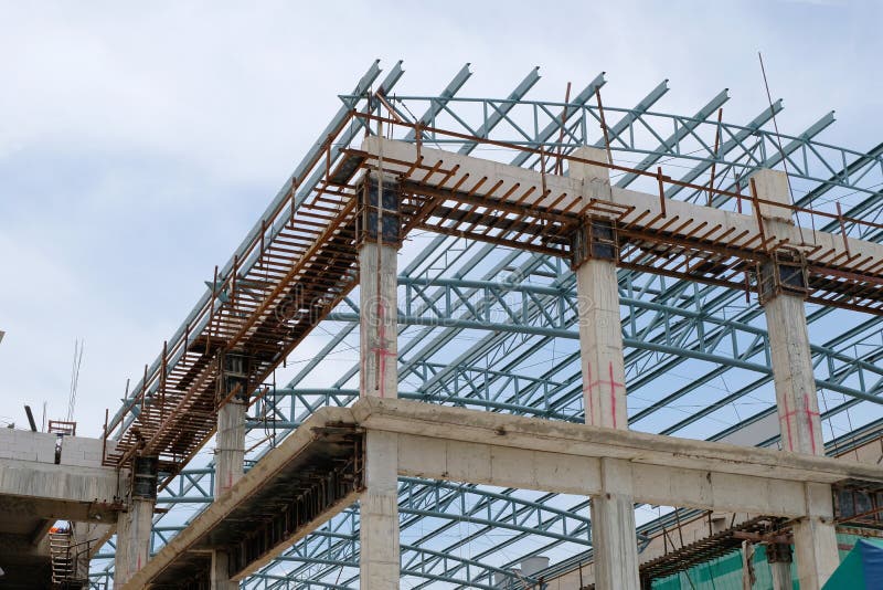 Steel Frames of a Building Under Construction, with Tower Crane on Top ...
