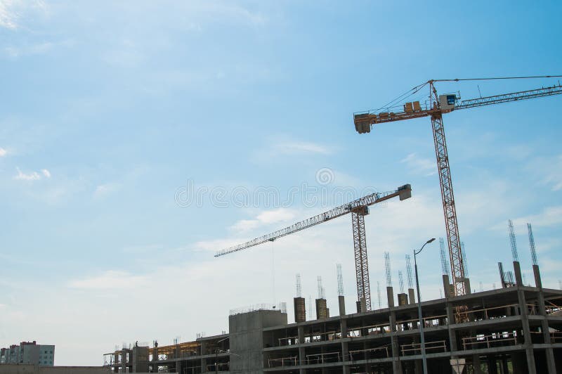 Steel Frames of a Building Under Construction, with Tower Crane on Top ...