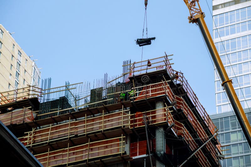 Steel Frames of a Building Under Construction with Tower Crane on Top ...