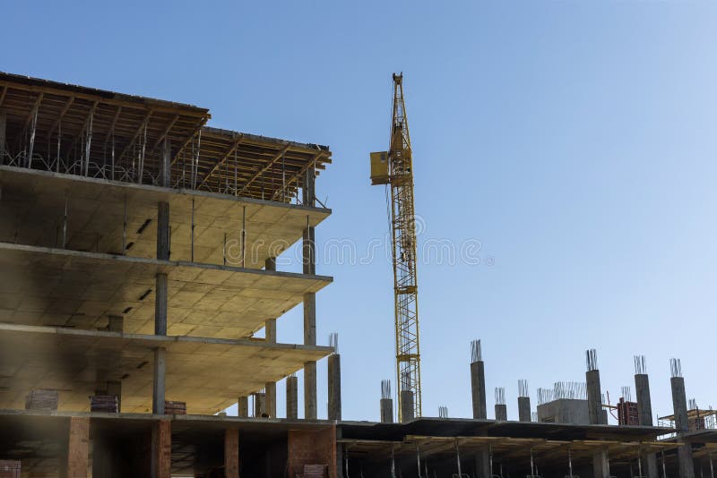 Steel Frames of a Building Under Construction with Tower Crane on Top ...
