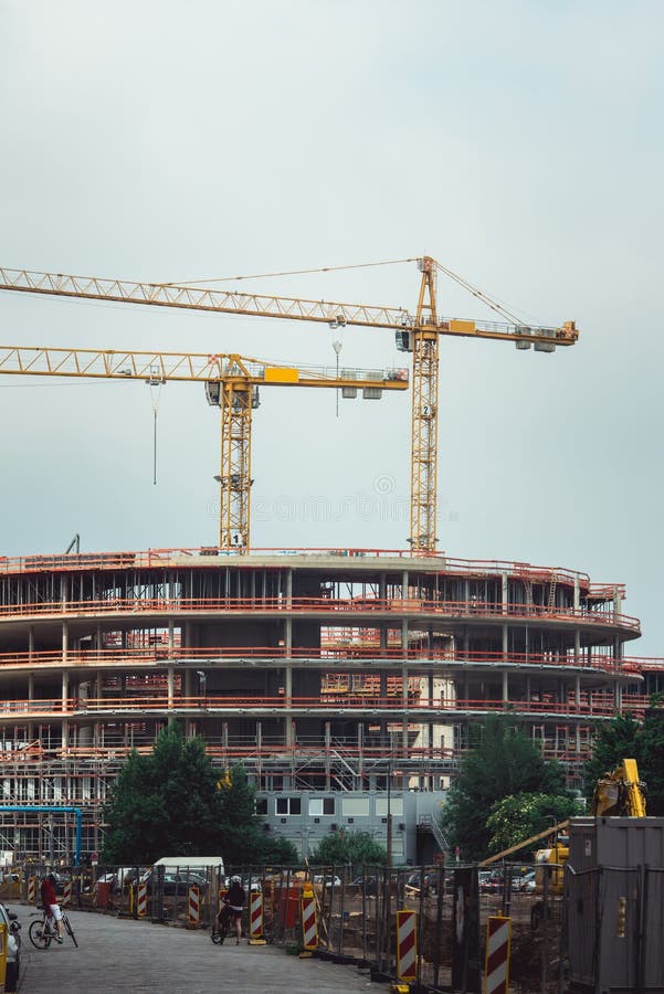 Steel Frames of a Building Under Construction, with Two Tower Cranes on ...