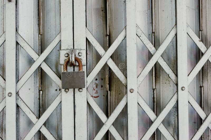 Steel gate with key lock stock image. Image of space - 22806341