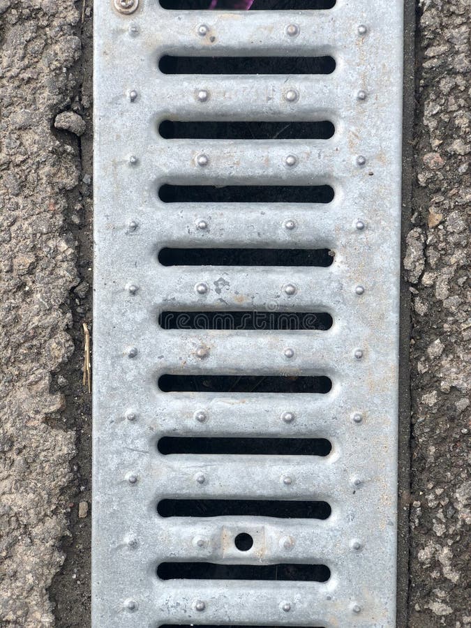 Steel grate for gutter stock photo. Image of flooring - 212932706