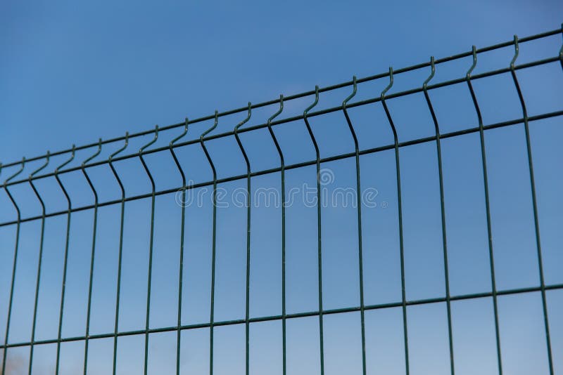 Steel Grill Fence with Wire Against the Blue Sky Stock Photo - Image of ...