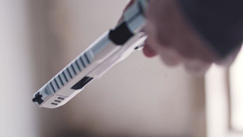 A Steel Gun in the Hands of a Man - Pulls the Shutter Stock Video ...