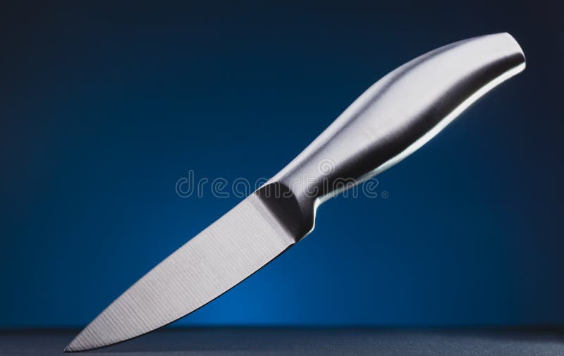 Steel Kitchen Knife on the Blue Stock Image - Image of sharp, blue ...