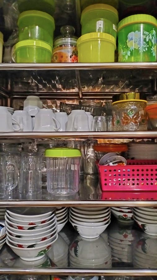 Steel Kitchen Rack Containing Kitchen Utensils Made of Plastic, Ceramic ...