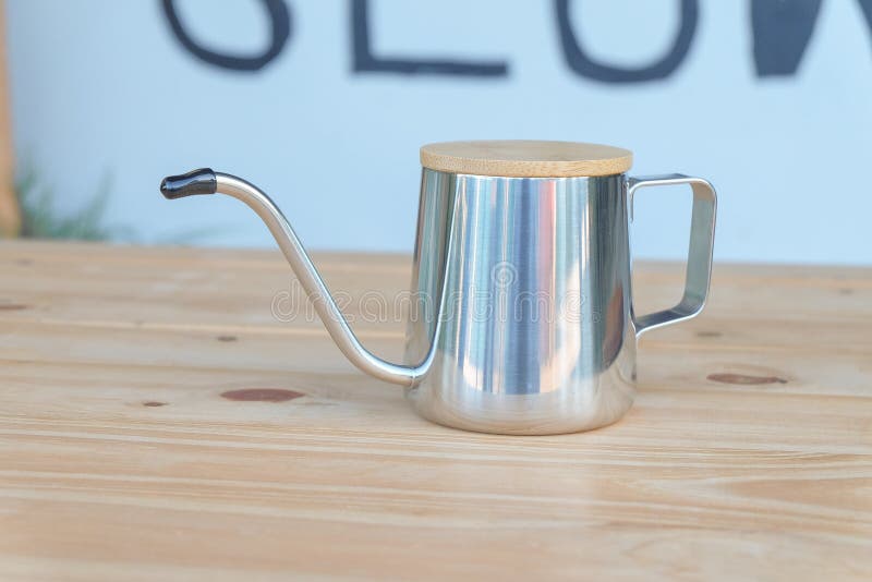 Steel Long Spout Drop Kettle on Wood Stock Image - Image of female ...