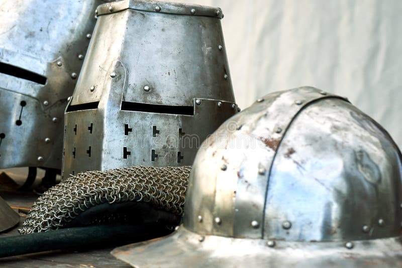 Steel Medieval Helmets with Eyes Slits on the Table Stock Image - Image ...
