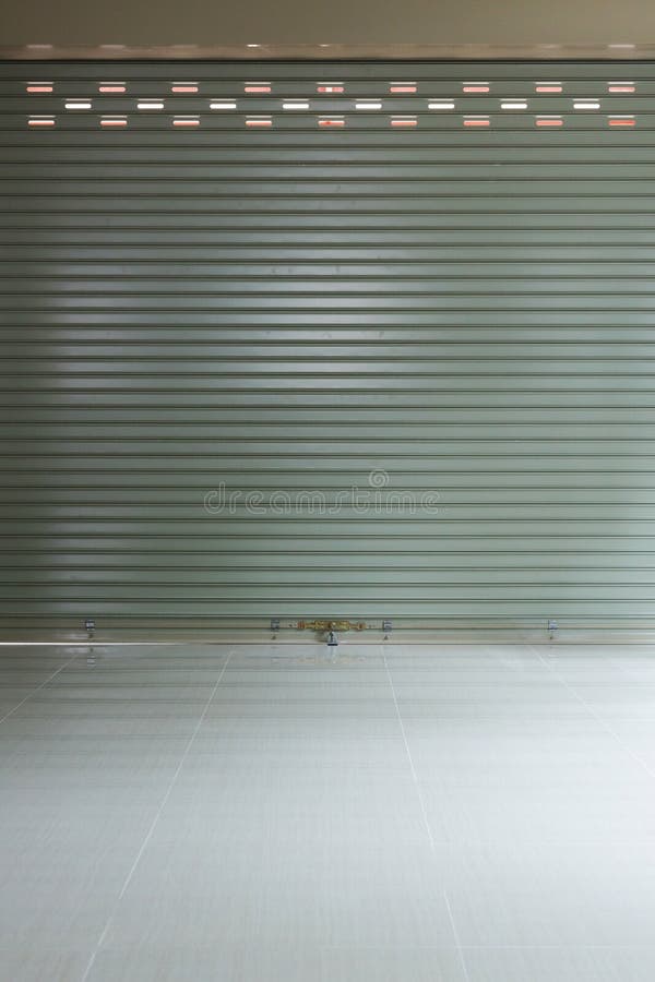 Steel Metal Door, Roller Shutter Door and Tile Floor Stock Photo ...