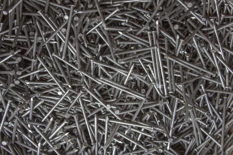 Steel Nails Lie in a Pile Close-up. Rough Surface Texture Stock Photo ...