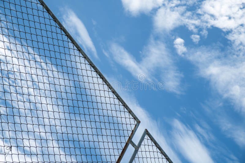 Steel Net Fence Against Blue Sky Stock Photo - Image of panel, barbed ...