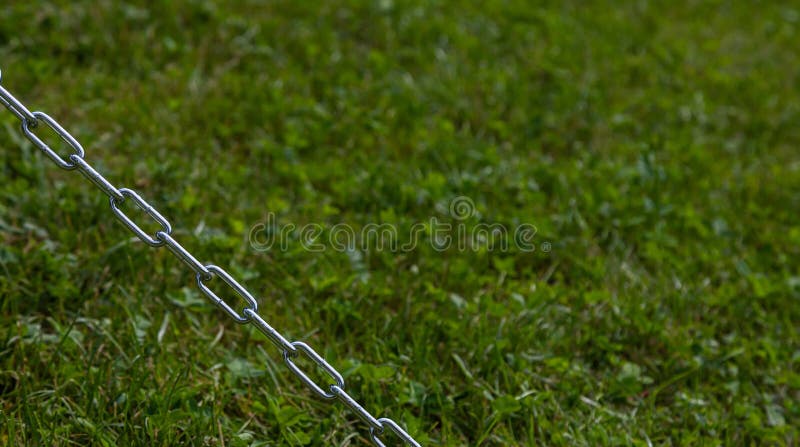 Steel Non-rusty Chain on Grass Background Stock Image - Image of ...