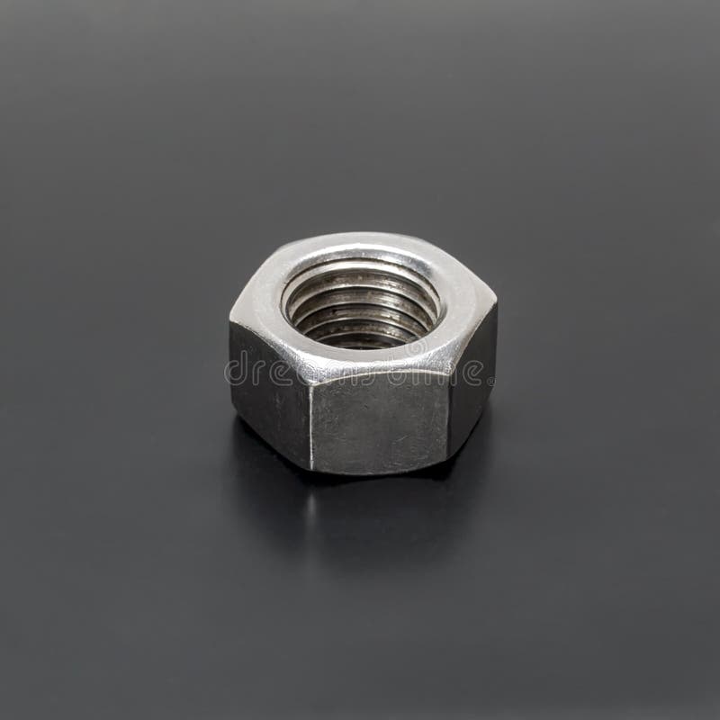 Steel Nut on a Gray Background. Side View Stock Photo - Image of ...