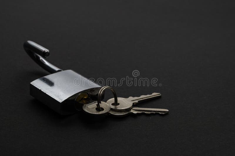 Steel Padlock with Three Keys on Black Surface Stock Image - Image of ...