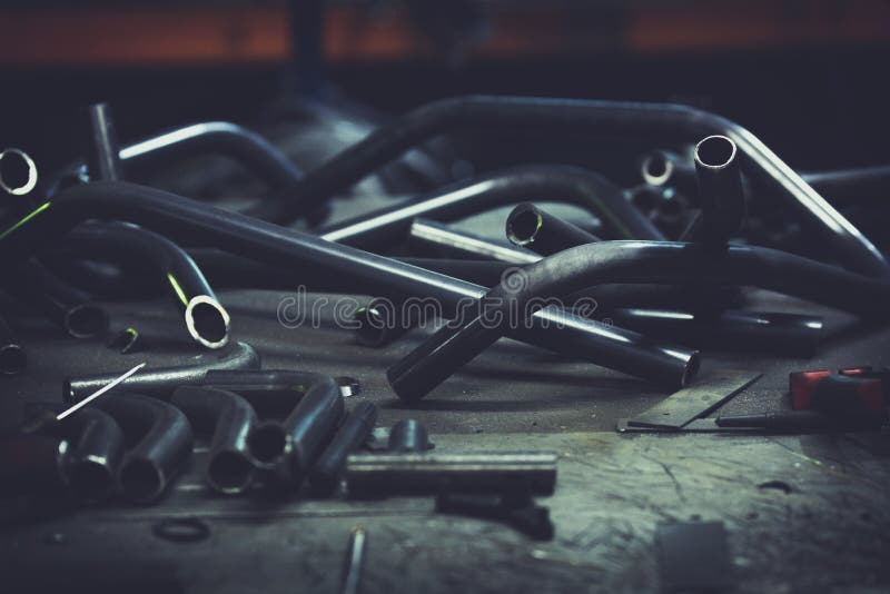 Steel Pipe and Tools Close Up on a Work Surface in a Metalwork ...