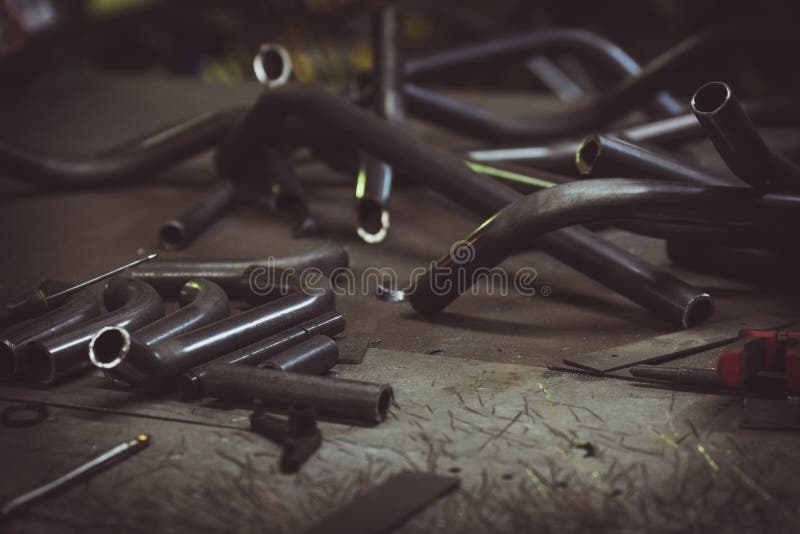 Steel Pipe and Tools Close Up on a Work Surface in a Metalwork ...
