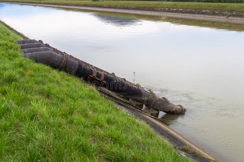 Steel Pipes Leading Below the Water Level Stock Photo - Image of metal ...