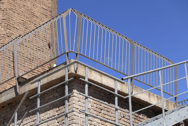 A Steel Railing Installed on the Terrace of a Gray Brick Building Stock ...