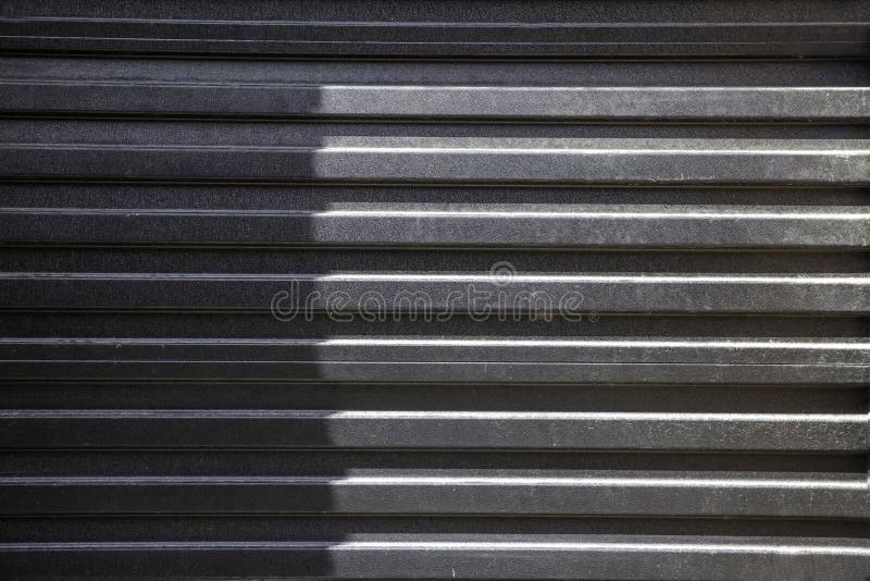 Steel Roller Shutter Kiosk Doors with Sunlight and Shadow on Surface ...