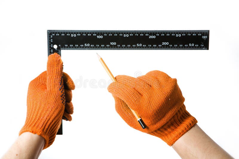 Steel Ruler in hand stock photo. Image of tool, color - 39312456
