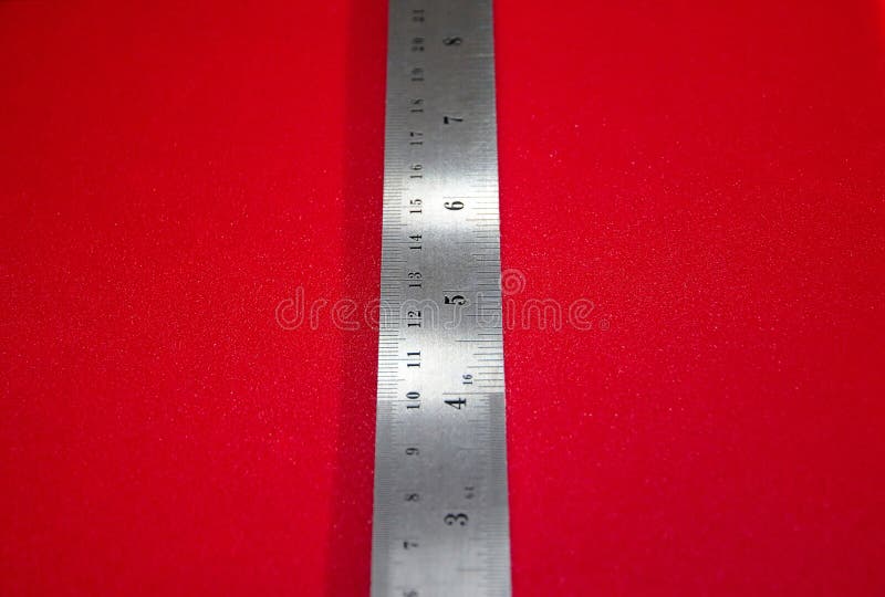 A Steel Ruler on Red Background Stock Image - Image of vertical ...