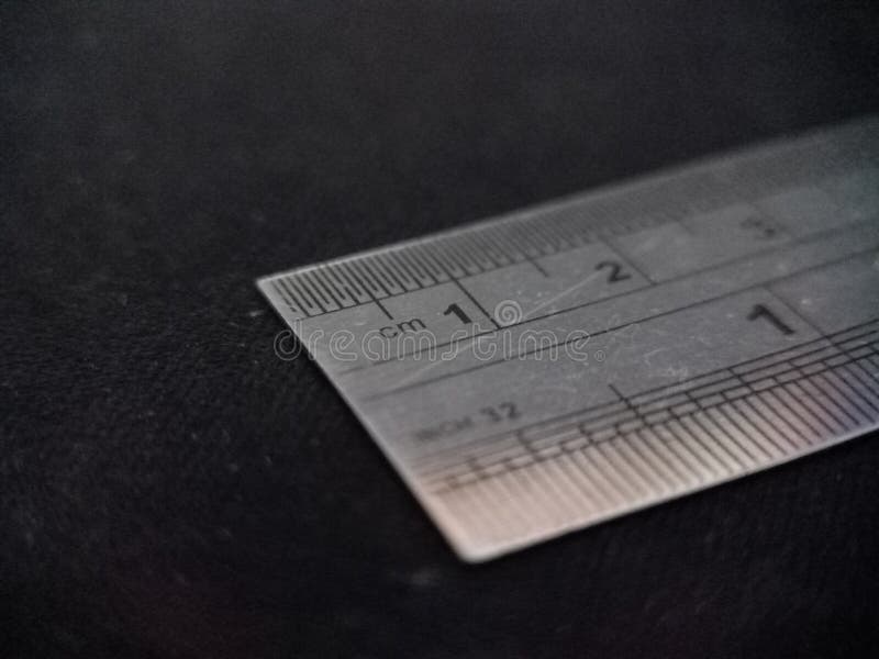 Steel Rules with Black Background Stock Photo - Image of inch, white ...