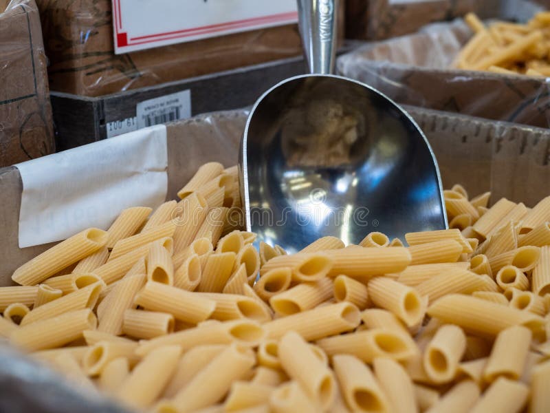 Steel Scoop Resting in Large Box of Penne Pasta Stock Photo - Image of ...