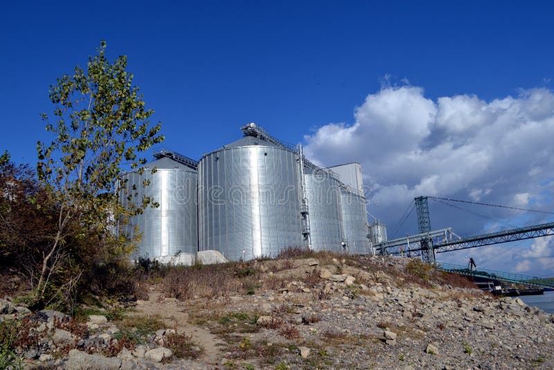 Steel Silos and Blue Sky with Clouds Stock Photo - Image of storage ...