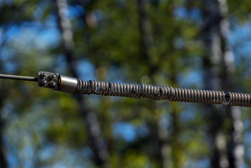A Steel Spring is Attached To a Metal Cable. Horizontally Stock Image ...