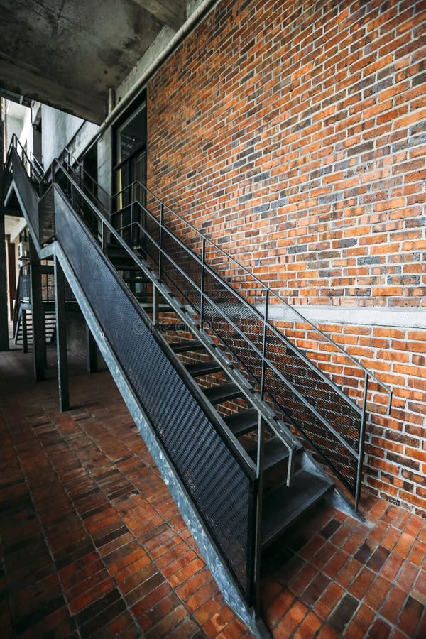 Steel Stairs with a Background of Old Red Brick Wall Texture Stock ...