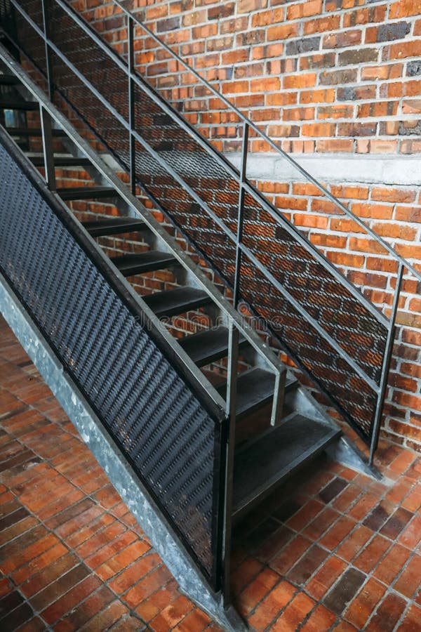 Steel Stairs with a Background of Old Red Brick Wall Texture Stock ...