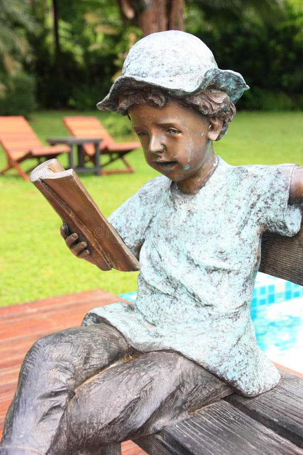 Statue Reading Boy Stock Photos - Download 126 Royalty Free Photos