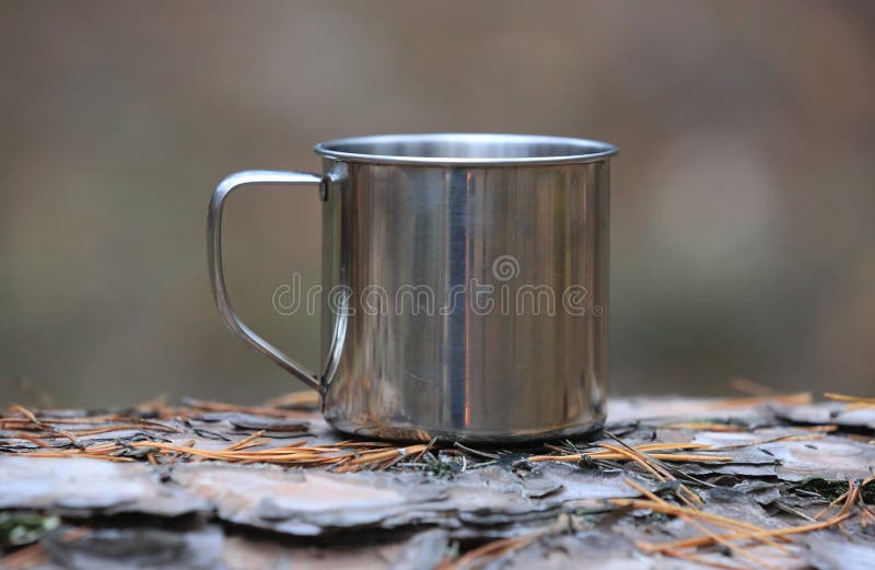 Steel Tourist Cup on a Log in the Forest Stock Photo - Image of moss ...