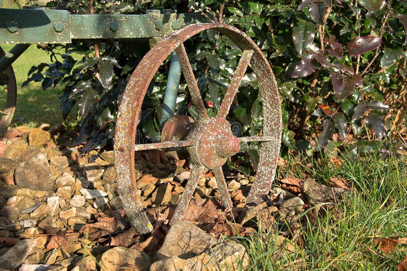 A Steel Wheel from an Old Plowed Plow Covered with Moss. Stock Image ...