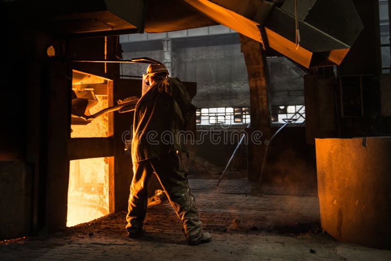 Steelworker at Work Near the Working Arc Furnace Stock Image - Image of ...