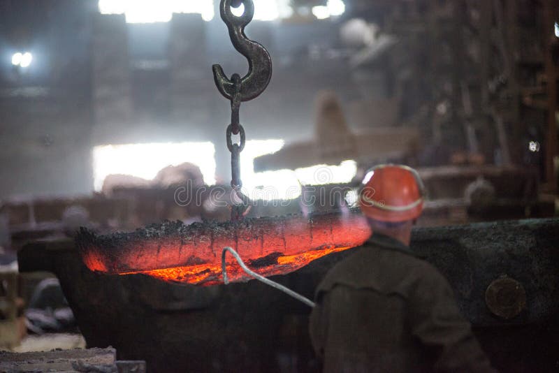Steelworker at Work Near the Tanks with Hot Metal Stock Photo - Image ...