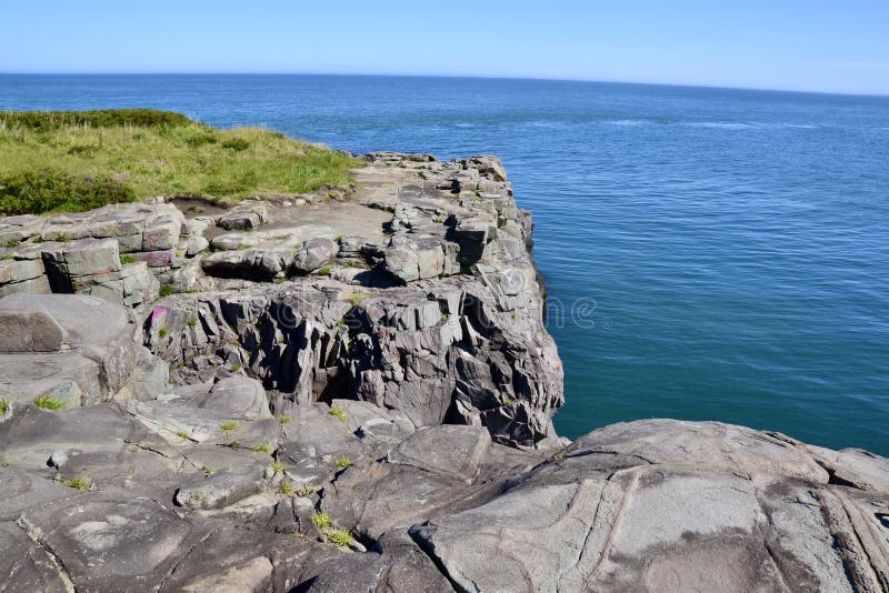 Steep Cliff Edge Along Bay of Fundy at Point Prim Stock Photo - Image ...
