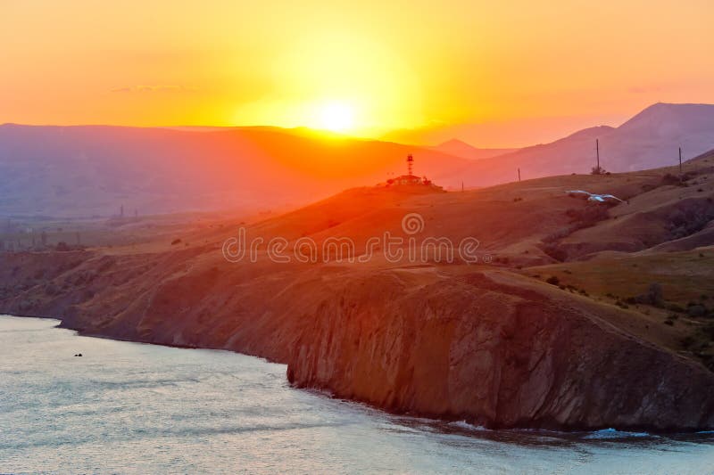 Steep Cliff at the Edge of the Sea at Sunset Stock Photo - Image of ...