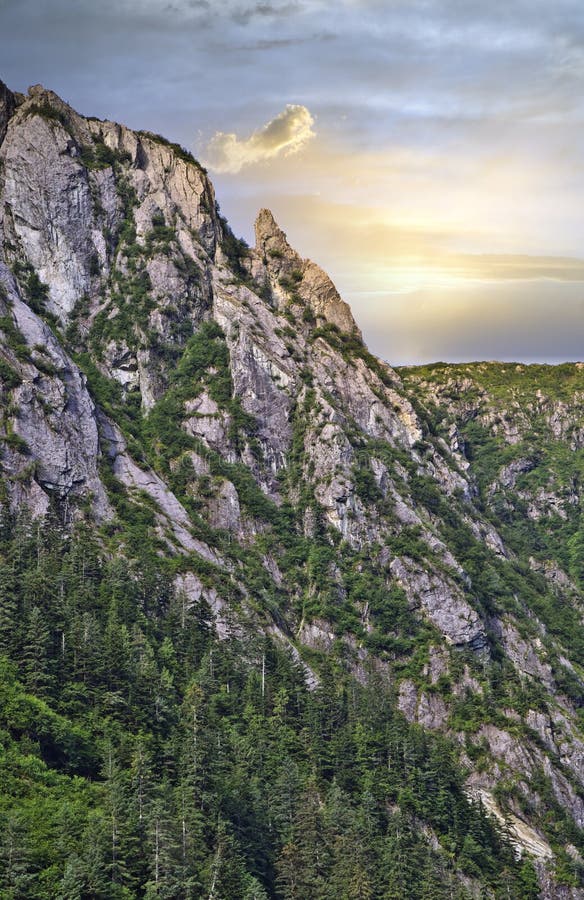 Steep Cliff at Sunset in Southeast Alaska Stock Image - Image of ...