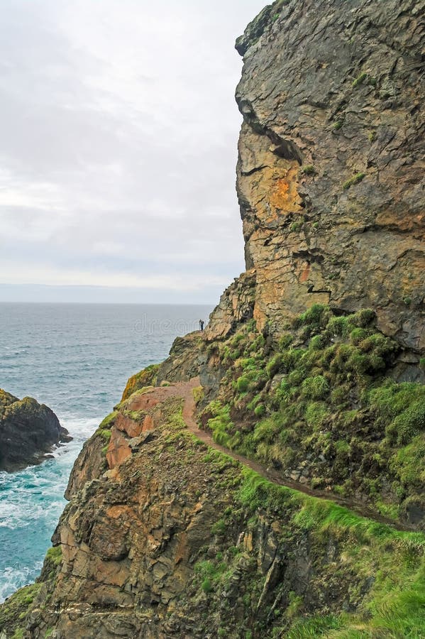 Steep Cliffs with Tiny Figure Stock Photo - Image of figure, harsh ...