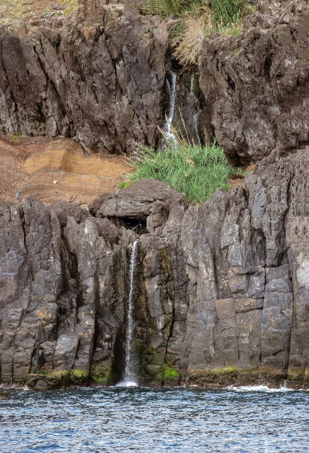 Steep Cliffs and Waterfall in Madeira and the Atlantic Ocean. Taken ...