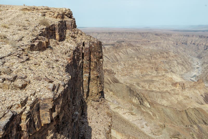 Steep rocky cliff stock photo. Image of lifeless, rocky - 240234316