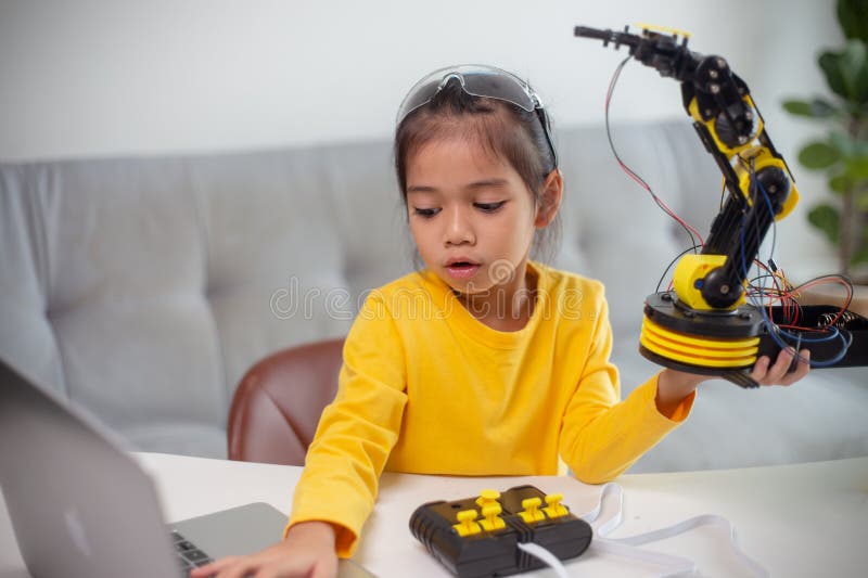 STEM Education Concept. Asian Students Learn at Home by Coding Robot ...
