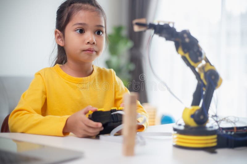 STEM Education Concept. Asian Students Learn at Home by Coding Robot ...