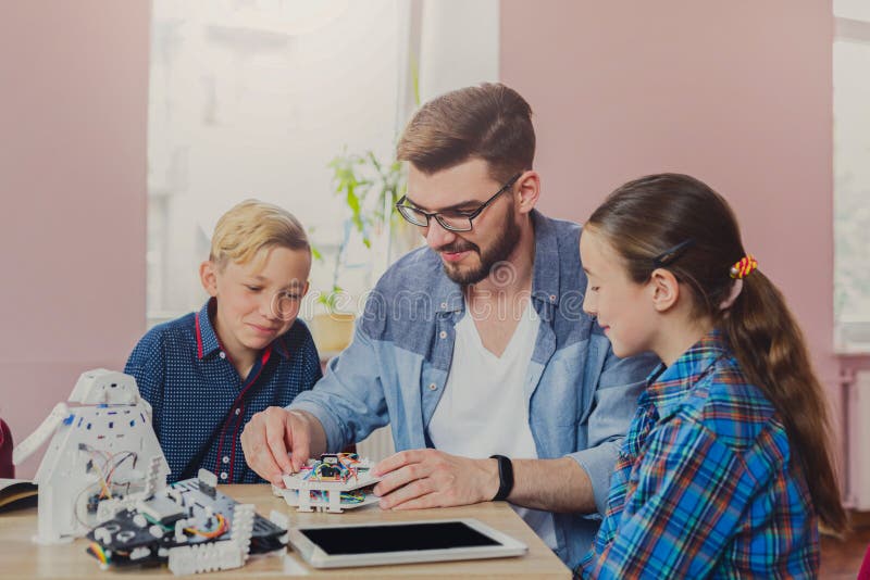 Stem Education. Kids Creating Robots with Teacher Stock Photo - Image ... Stem Education. Kids Creating Robots with Teacher Stock Photo - Image ...